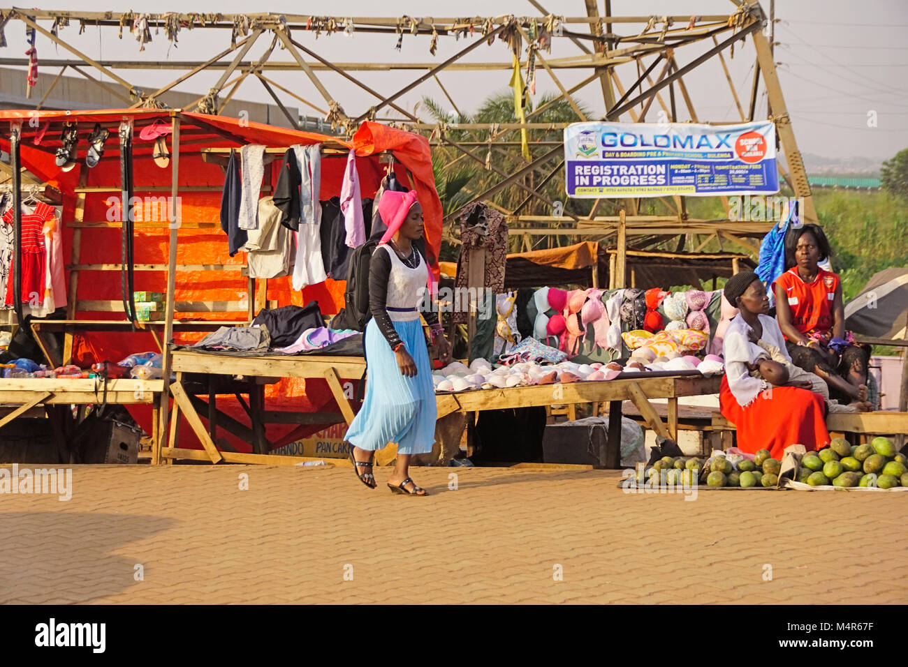 Women traders selling merchandise at roadside kiosk in Kampala, Uganda ...