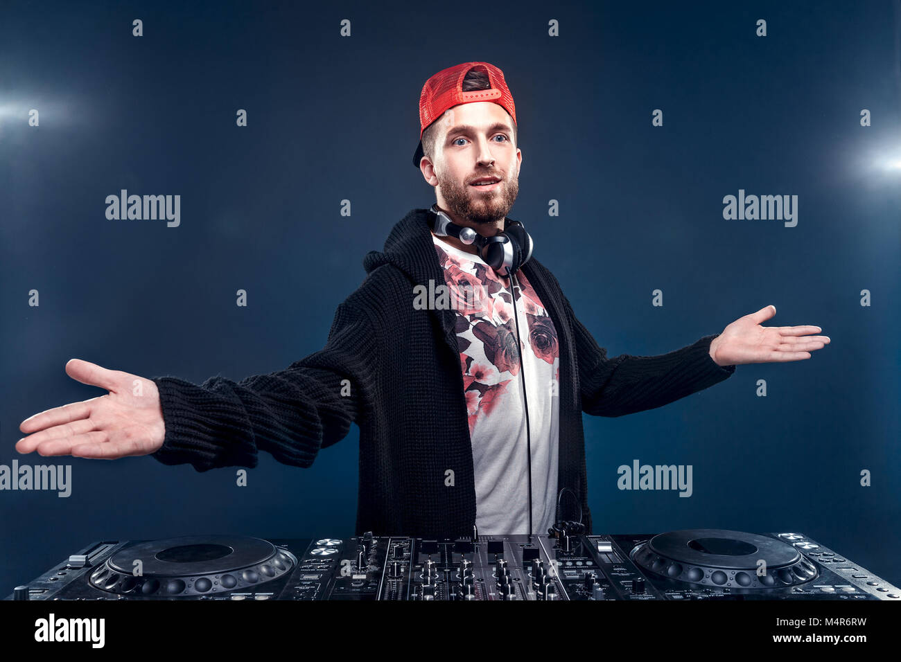 Man play music on a dj's mixer. Studio shot. Light Flare Stock Photo ...