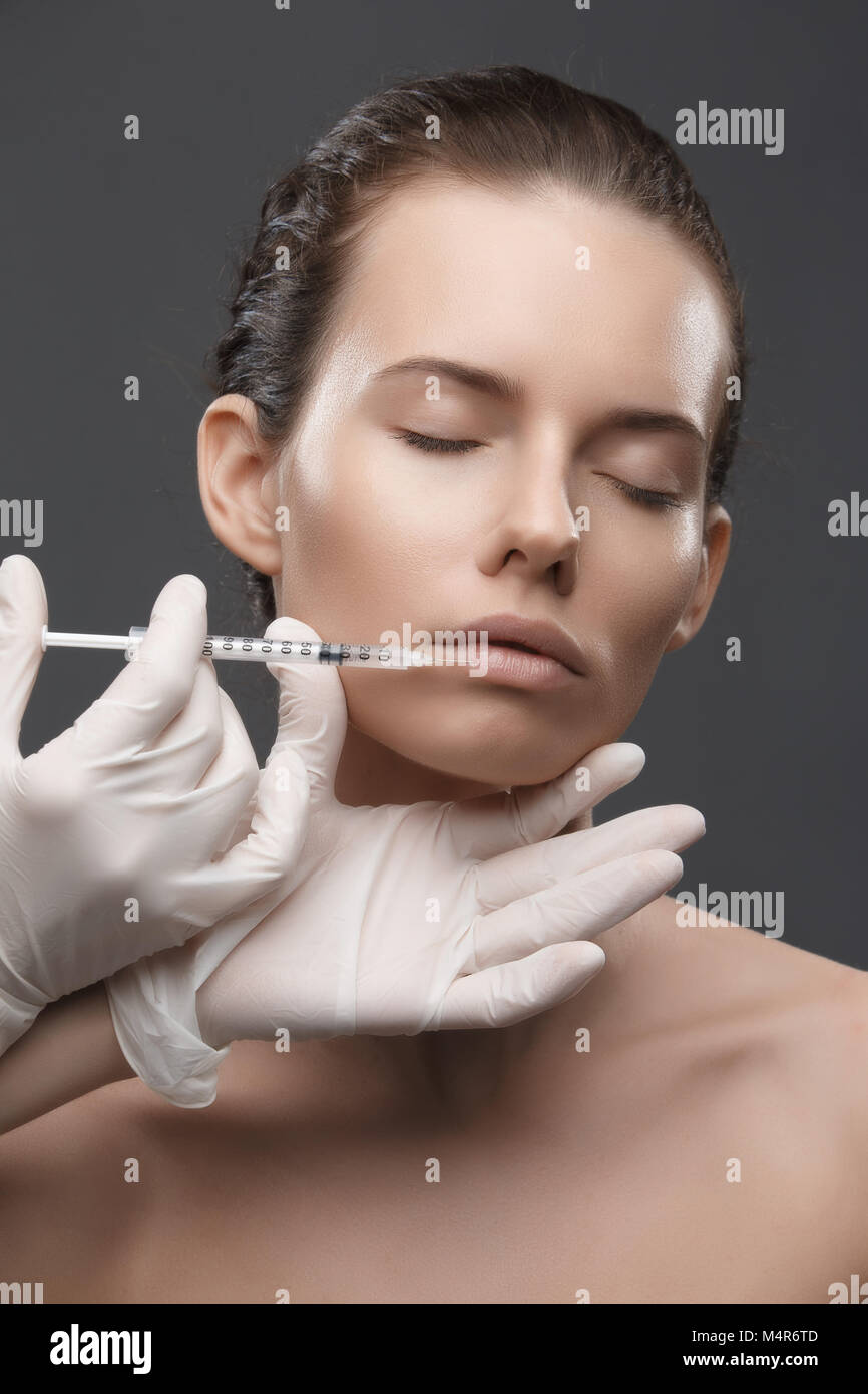 Woman getting an injection hi-res stock photography and images - Alamy