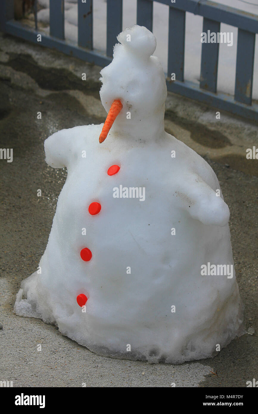 a snowman on the road Stock Photo - Alamy