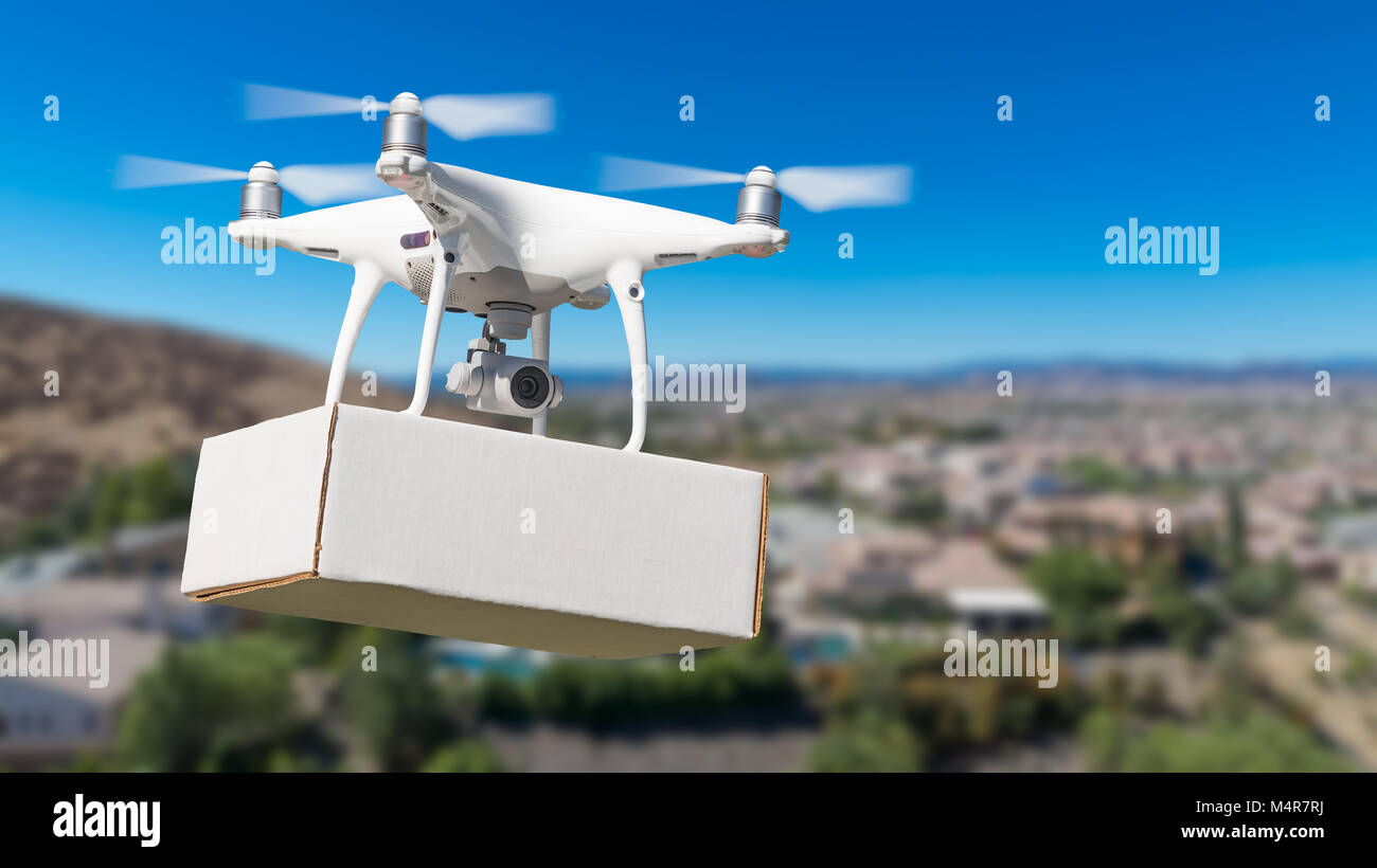 Unmanned Aircraft System (UAS) Quadcopter Drone Carrying Blank Package ...