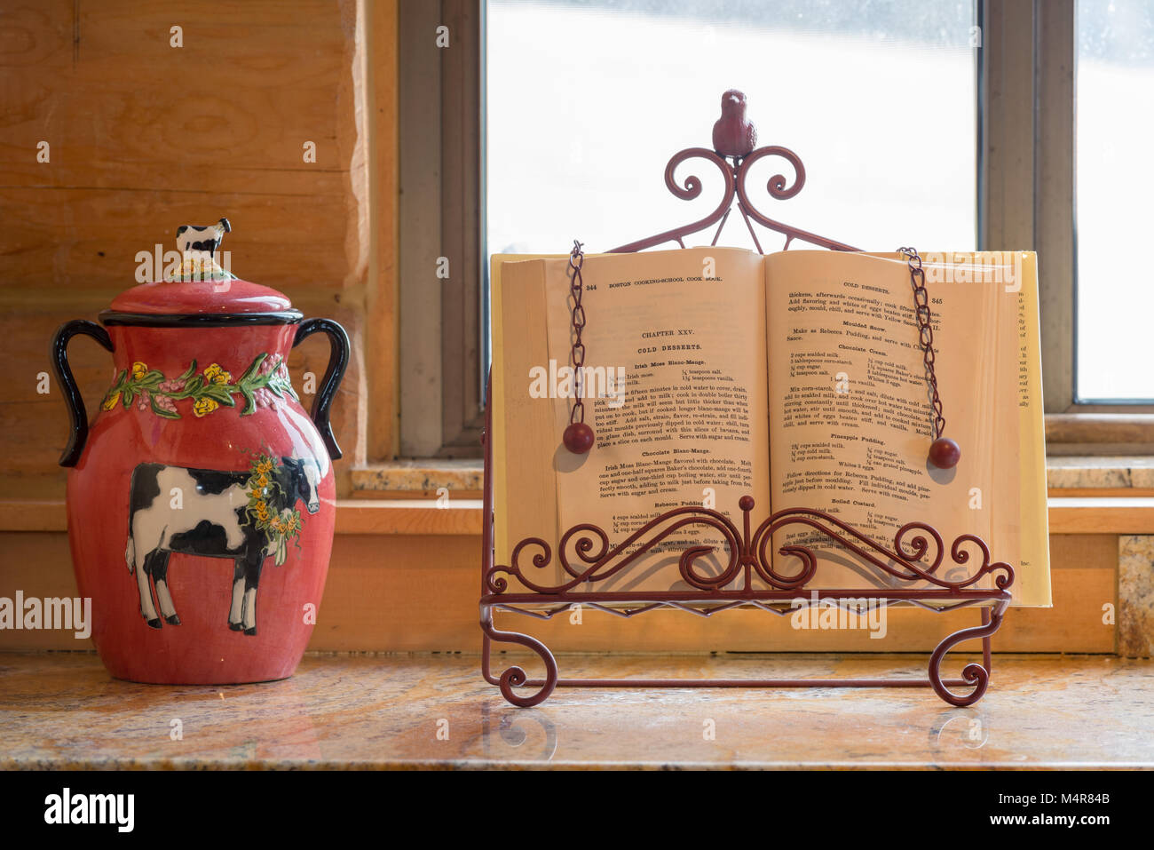 Cookbook in a cookbook holder on a kitchen counter Stock Photo - Alamy
