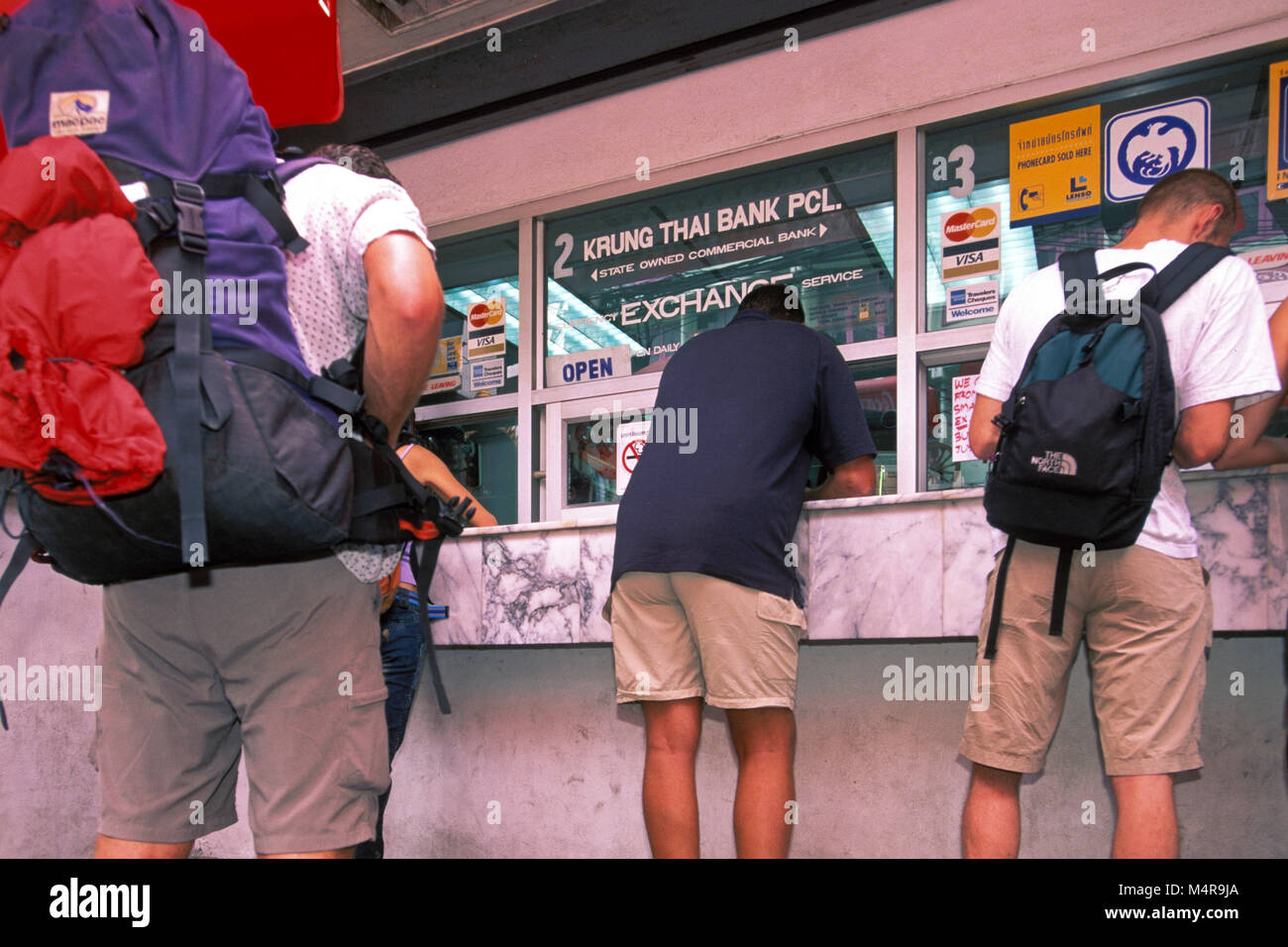 Backpackers at currency exchange, Bangkok, Thailand Stock Photo - Alamy