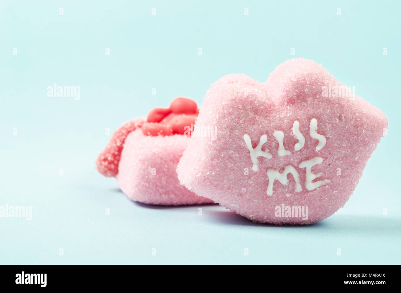 Heart-shaped Valentines candies with "KISS ME" text Stock Photo - Alamy