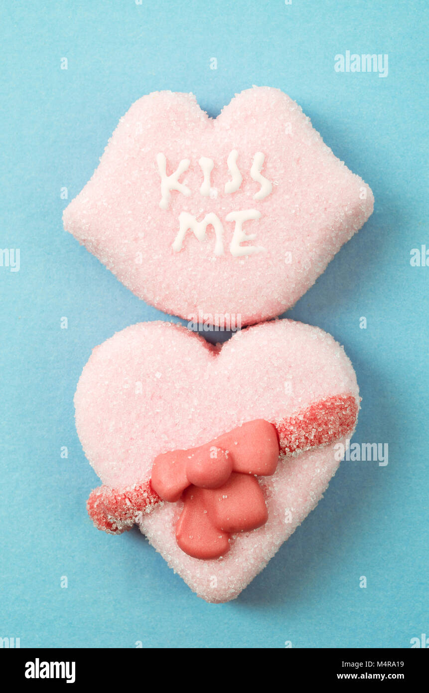 Heart-shaped Valentines candies with "KISS ME" text Stock Photo - Alamy
