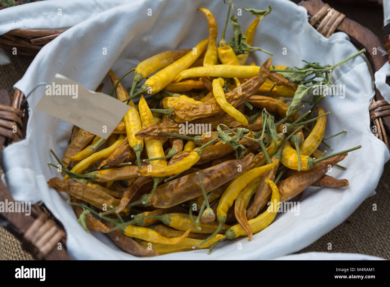 Yellow Dried Chili Peppers inside White Bowl Stock Photo - Alamy