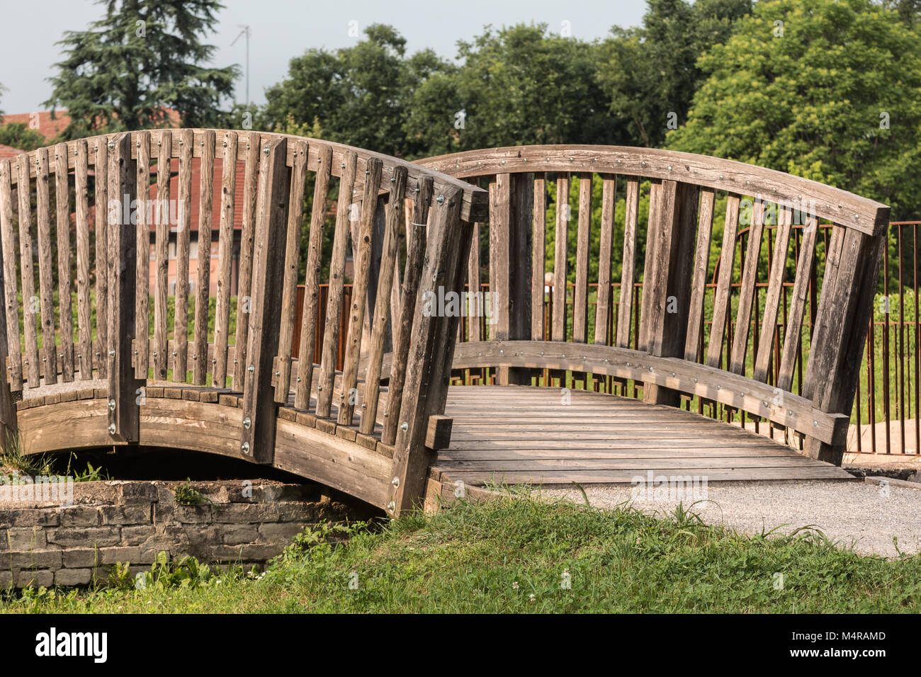 Little Pedestrian Curved Wooden Bridge in a Park Stock Photo - Alamy