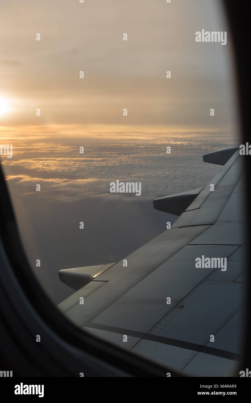 Looking Outside a Window of an Aircraft Cabin: White Airplane Wing and ...