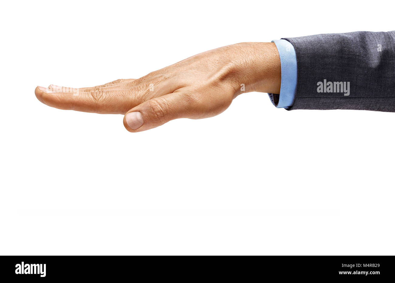Man's hand in suit closes something isolated on white background. Close ...