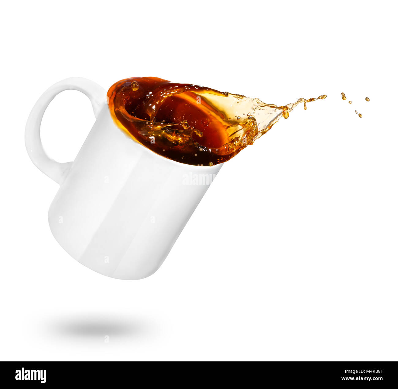 mug of spilling coffee or tea isolated on white background. Coffee ...