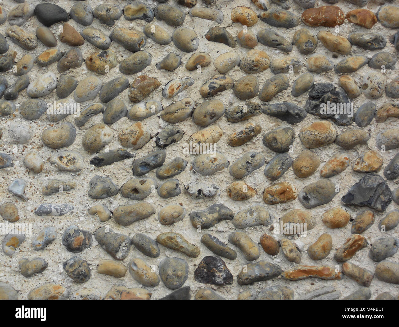Wall of Stones Set in Mortar Stock Photo - Alamy