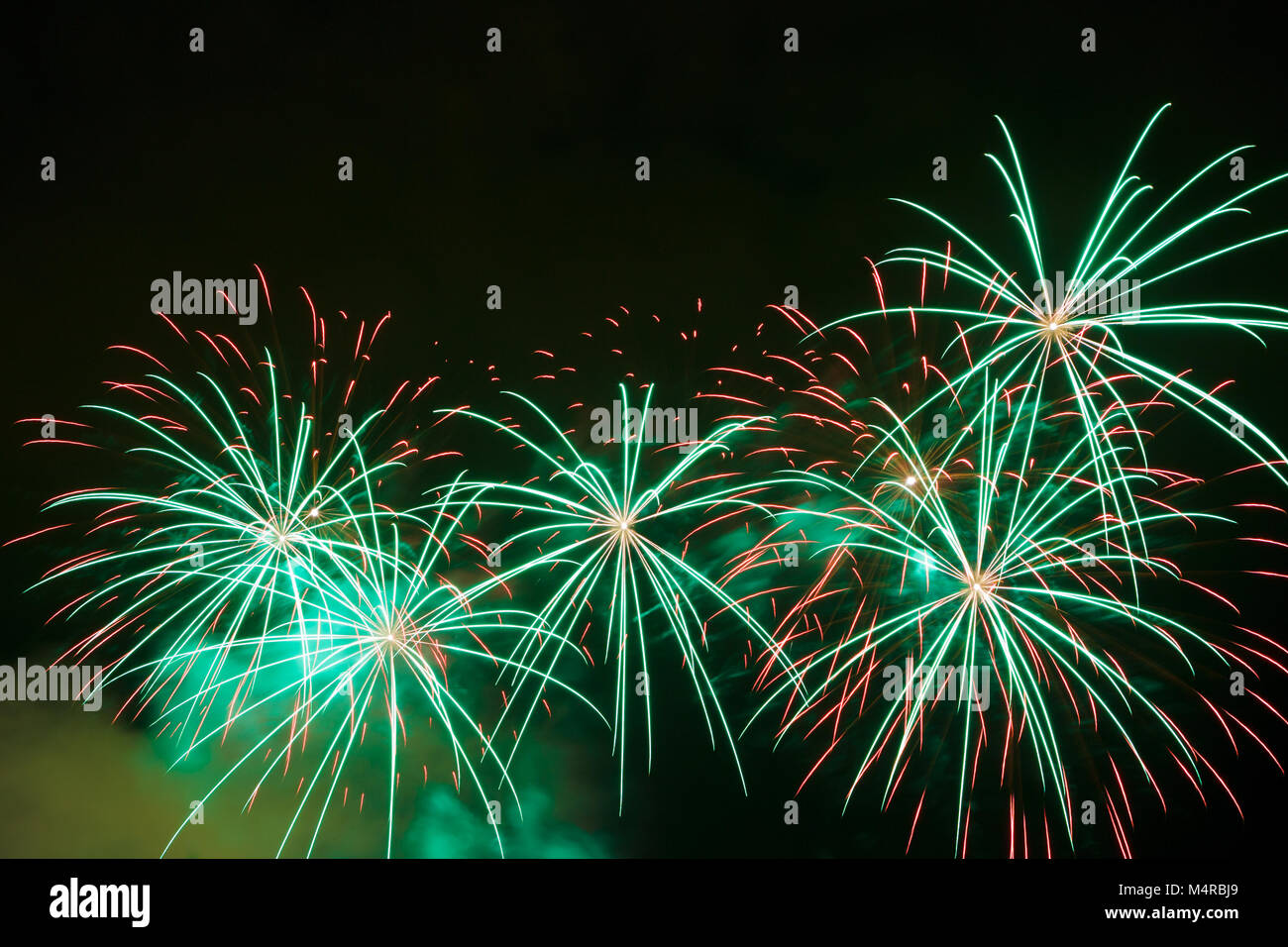 Beautiful fireworks on night sky Stock Photo - Alamy
