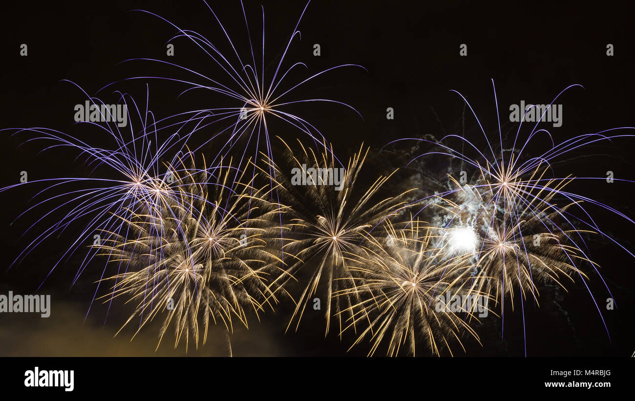 Beautiful fireworks on night sky Stock Photo - Alamy