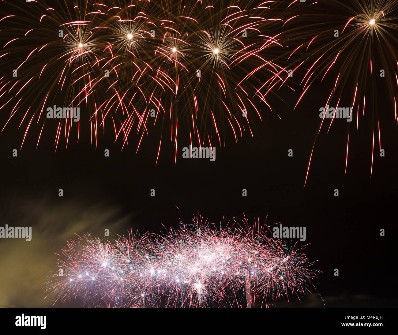 Beautiful fireworks on night sky Stock Photo - Alamy