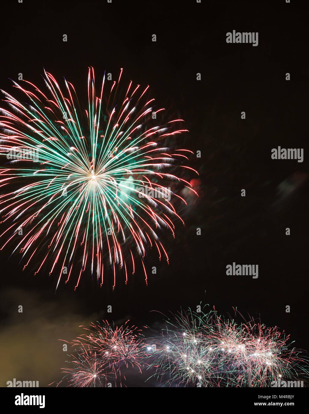 Beautiful fireworks on night sky Stock Photo - Alamy