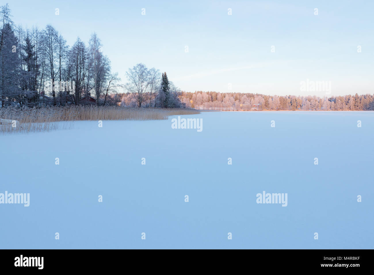 Winter lake scenery in finland Stock Photo - Alamy