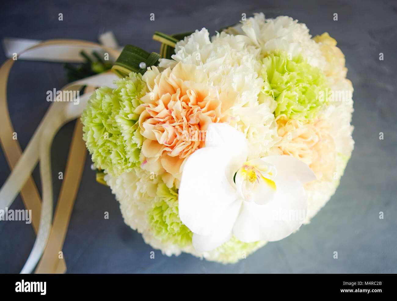 Beautiful bridal bouquet with fresh pastel colored carnation flowers ...