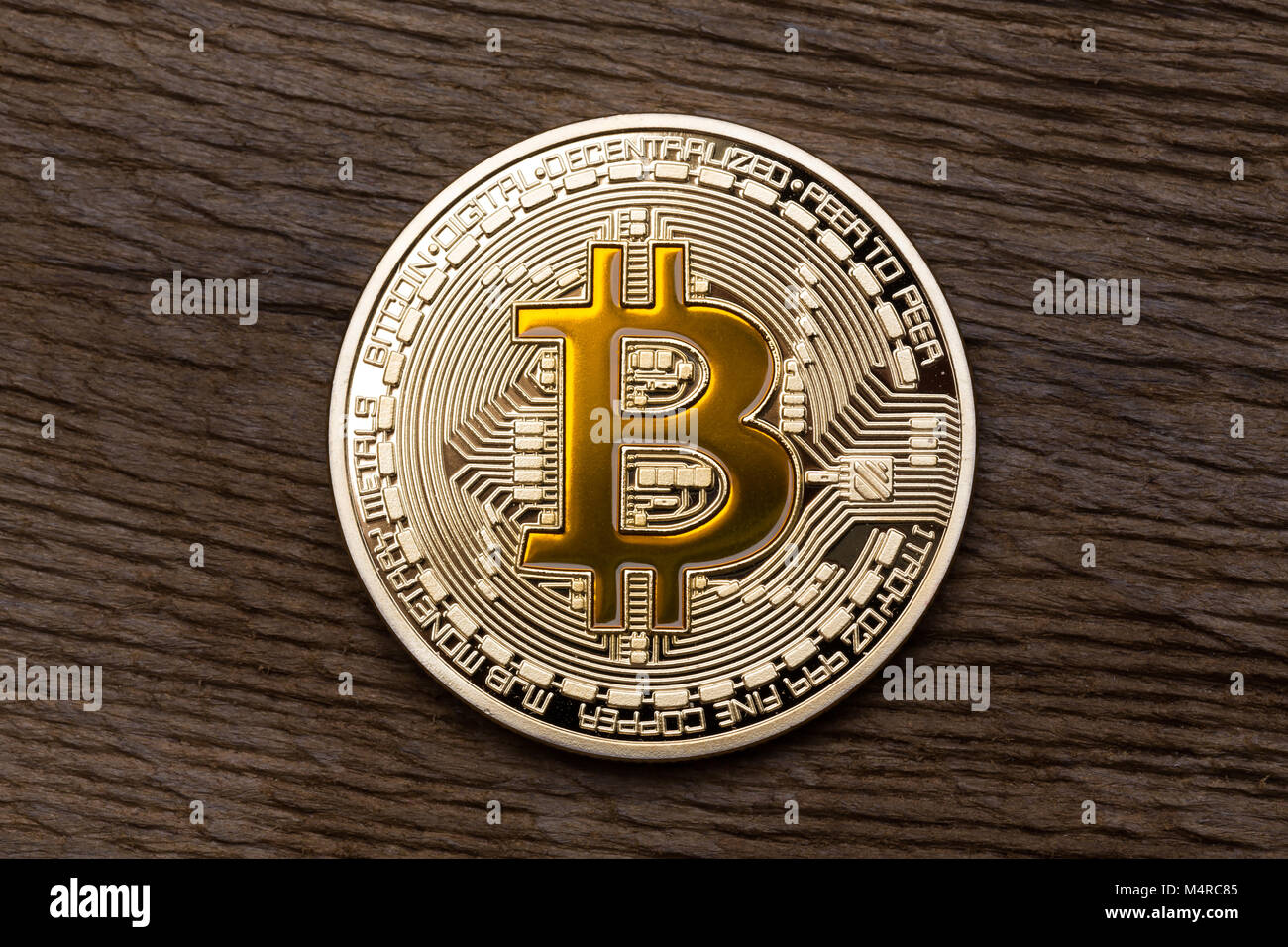 Golden yellow bitcoin on wooden background. High resolution photo Stock ...
