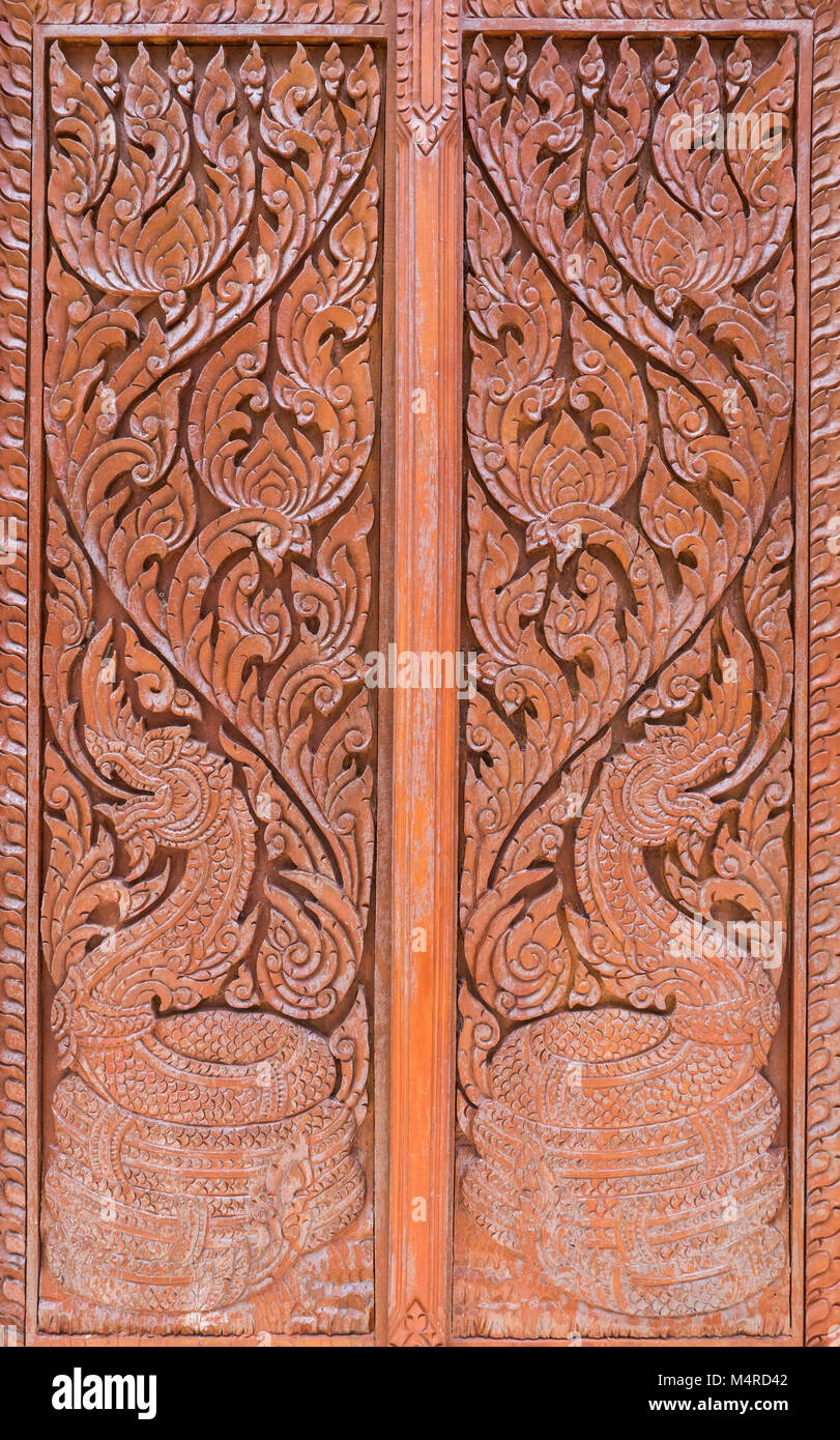 Carving pattern with the dragon symbol in the traditional Thai style on ...