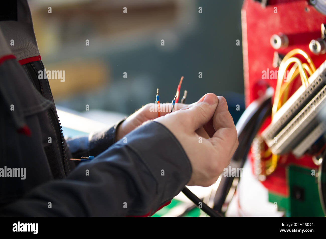 Electrician works with electric wires Stock Photo - Alamy