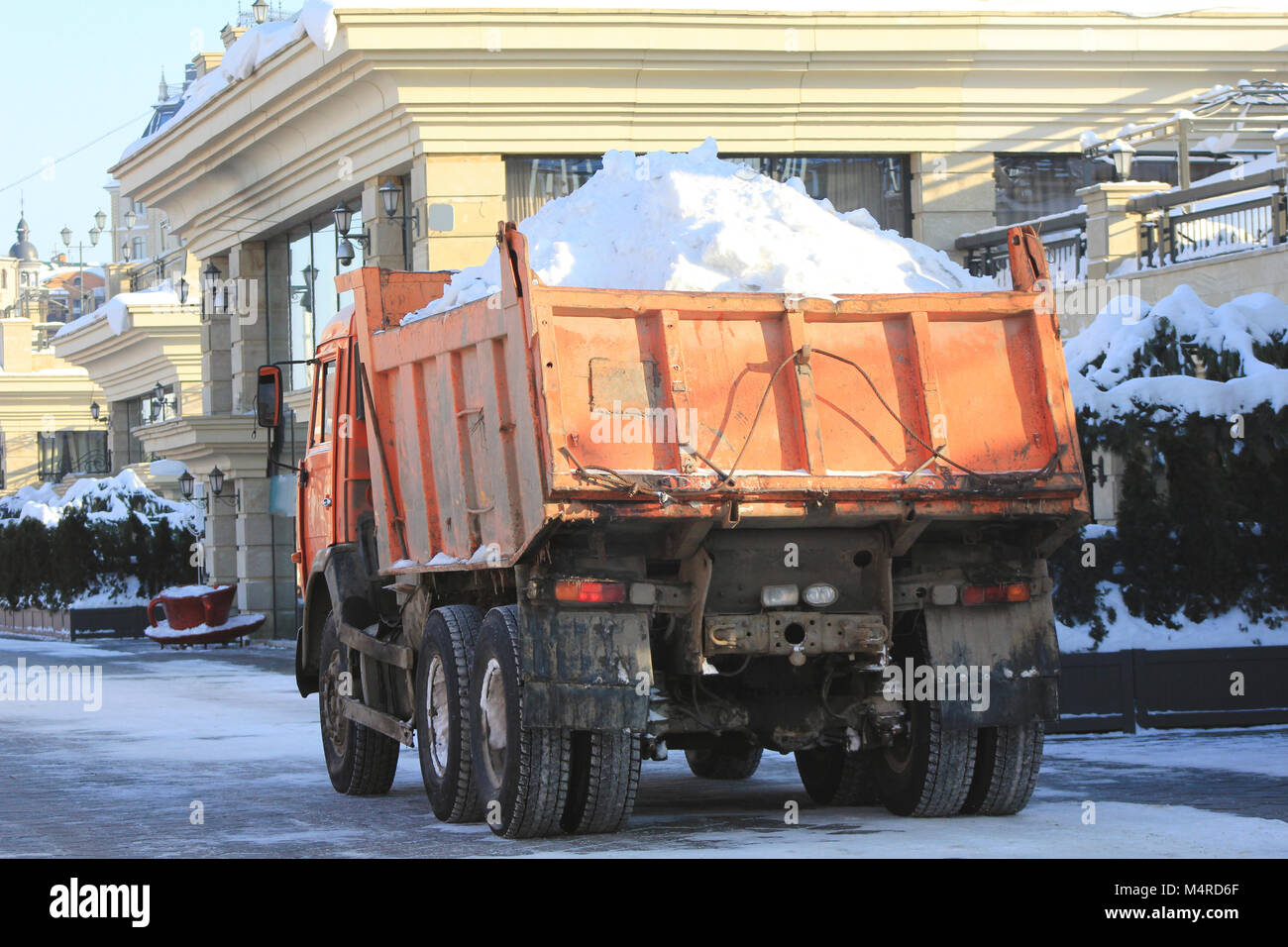Truck carrying the snow on the street in winter Stock Photo - Alamy