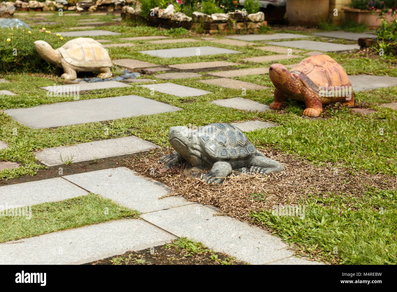 Three figures of turtles in the park. turtles on green grass Stock ...