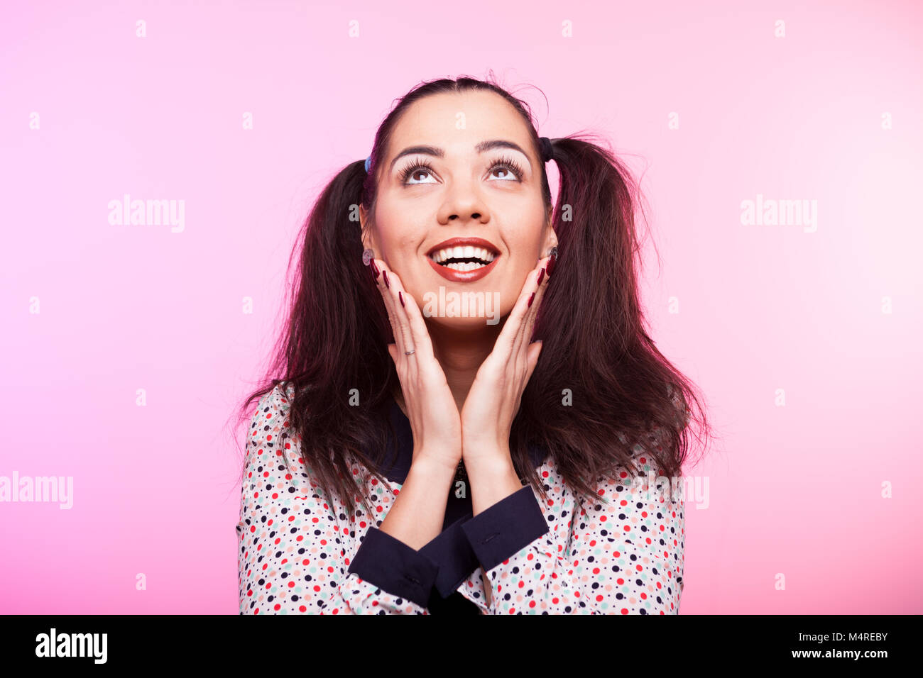 Surprised woman looking up Stock Photo - Alamy