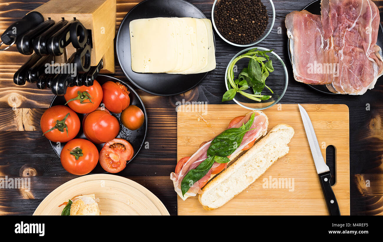 Making sandwiches at the kitchen Stock Photo - Alamy