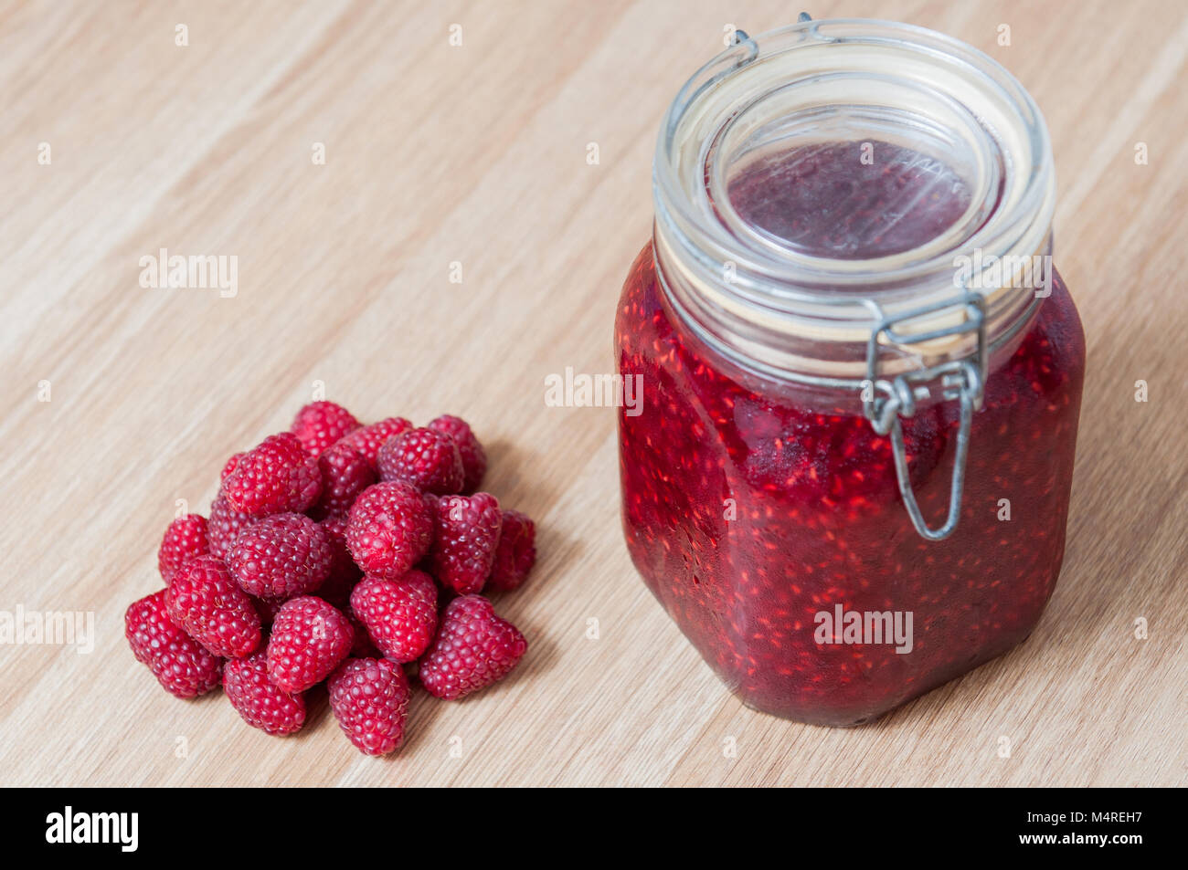 raspberry jam in jar isolated Stock Photo - Alamy