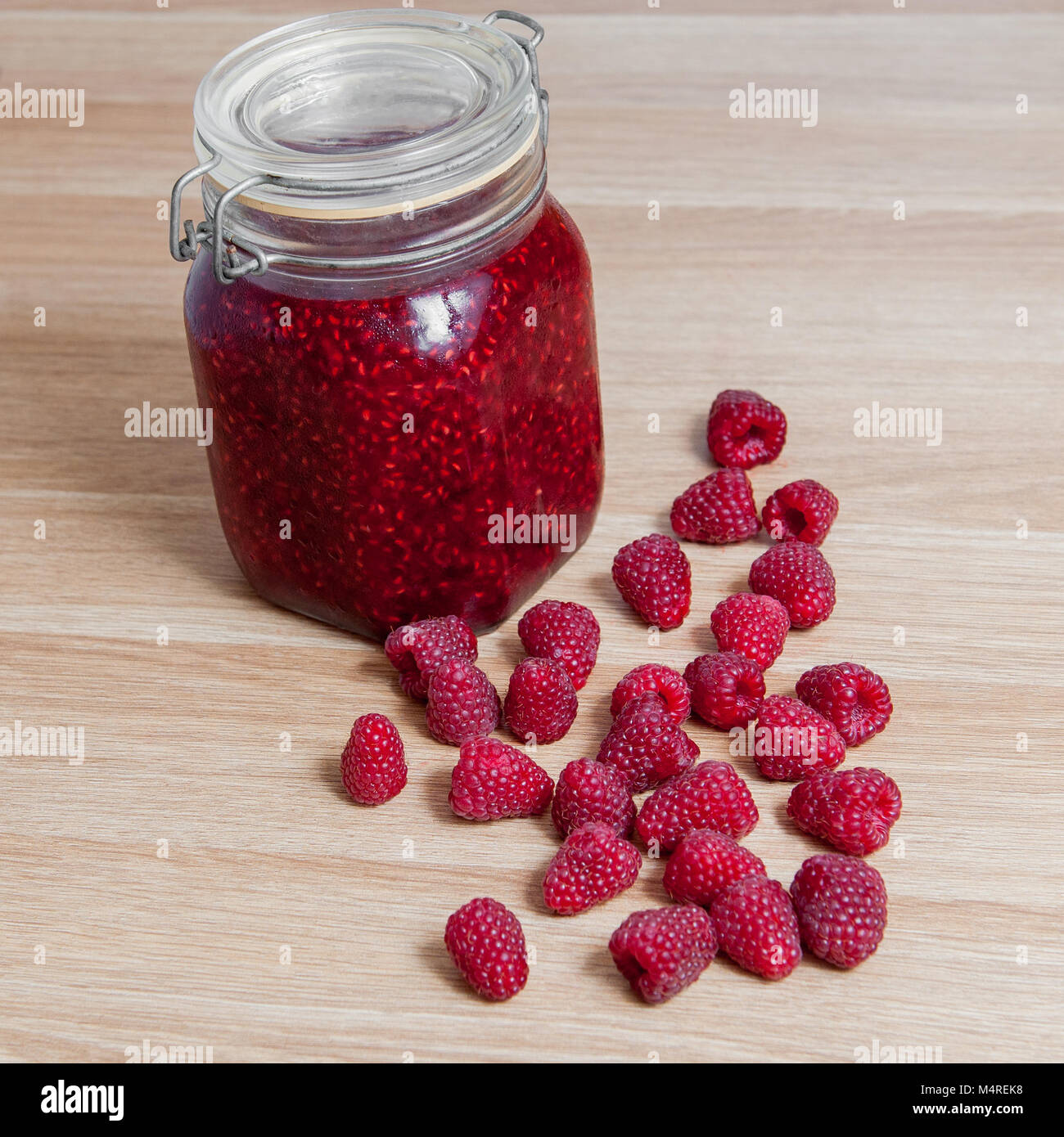 raspberry jam in jar isolated Stock Photo - Alamy
