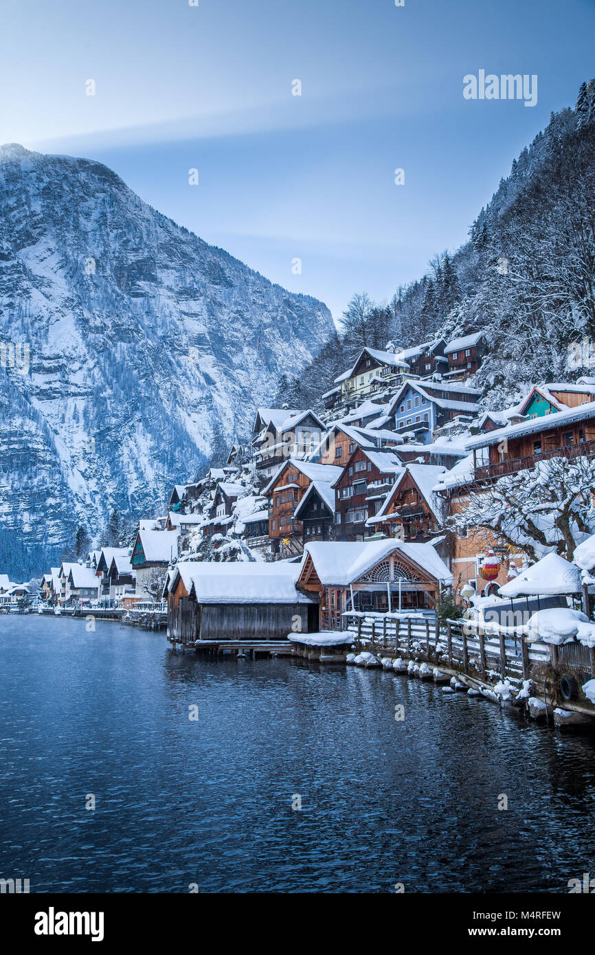 Classic postcard view of traditional wooden houses in famous Hallstatt lakeside town in the Alps ...