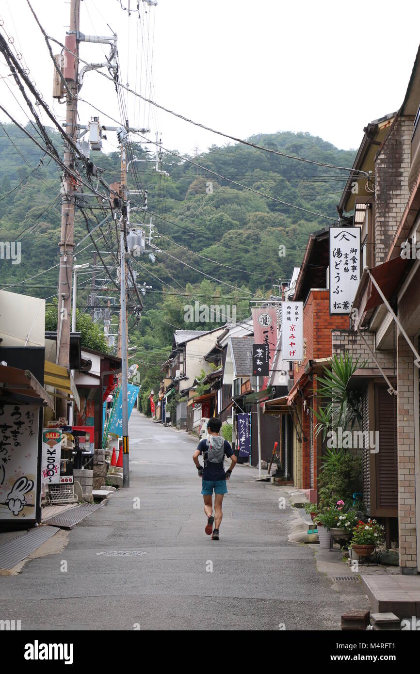Jogger in a desert street in Kyoto Stock Photo - Alamy