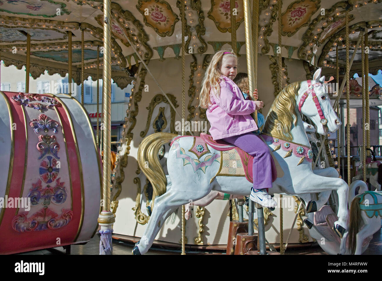 Merry go round girl hi-res stock photography and images - Alamy