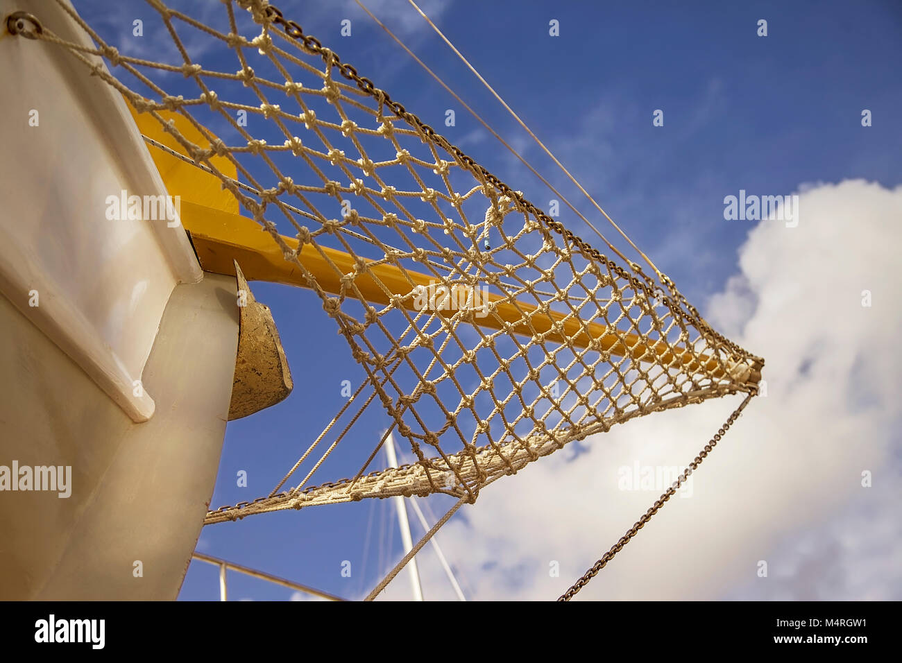 Ship's Bow. Wooden vintage sailboat with yard arm and safety net ...