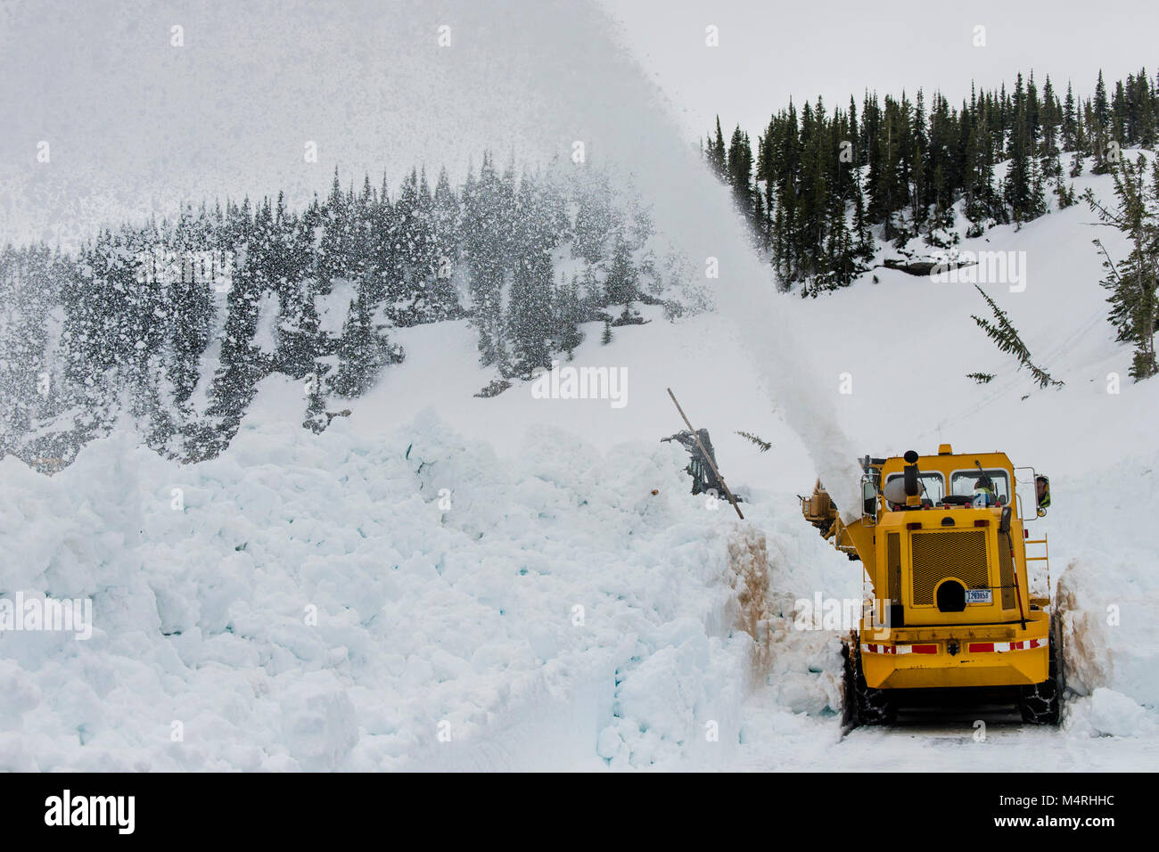 Snow blower at work clearing deep snow Stock Photo - Alamy