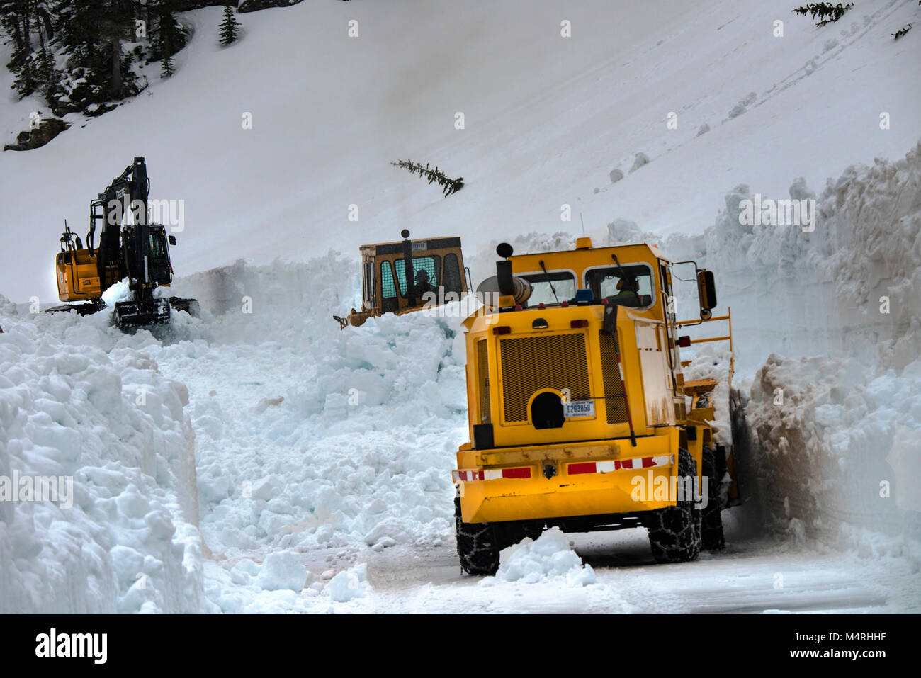 Snow blower at work clearing deep snow Stock Photo - Alamy