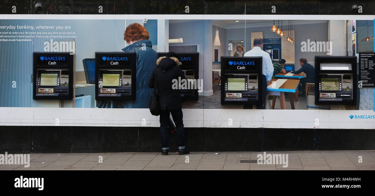 A row of five Barclays Bank cashpoint machines in central London ...