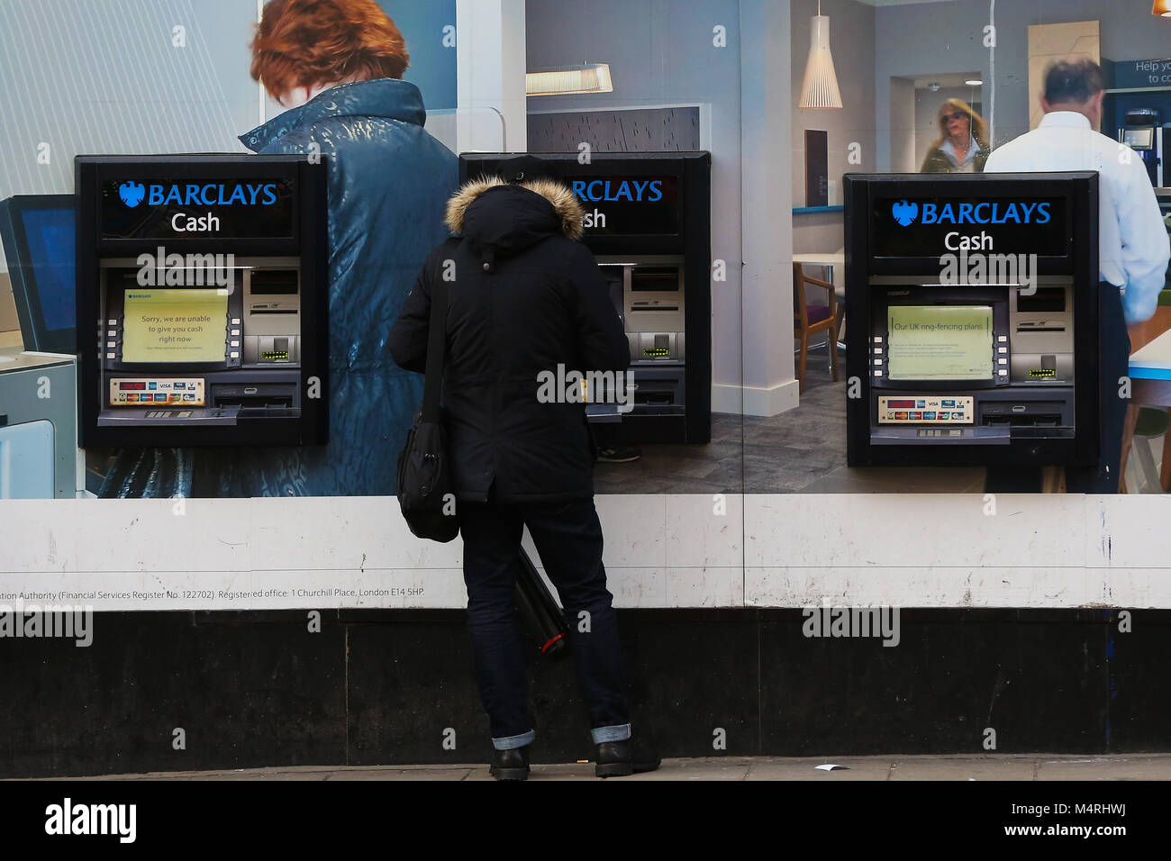 A row of five Barclays Bank cashpoint machines in central London ...