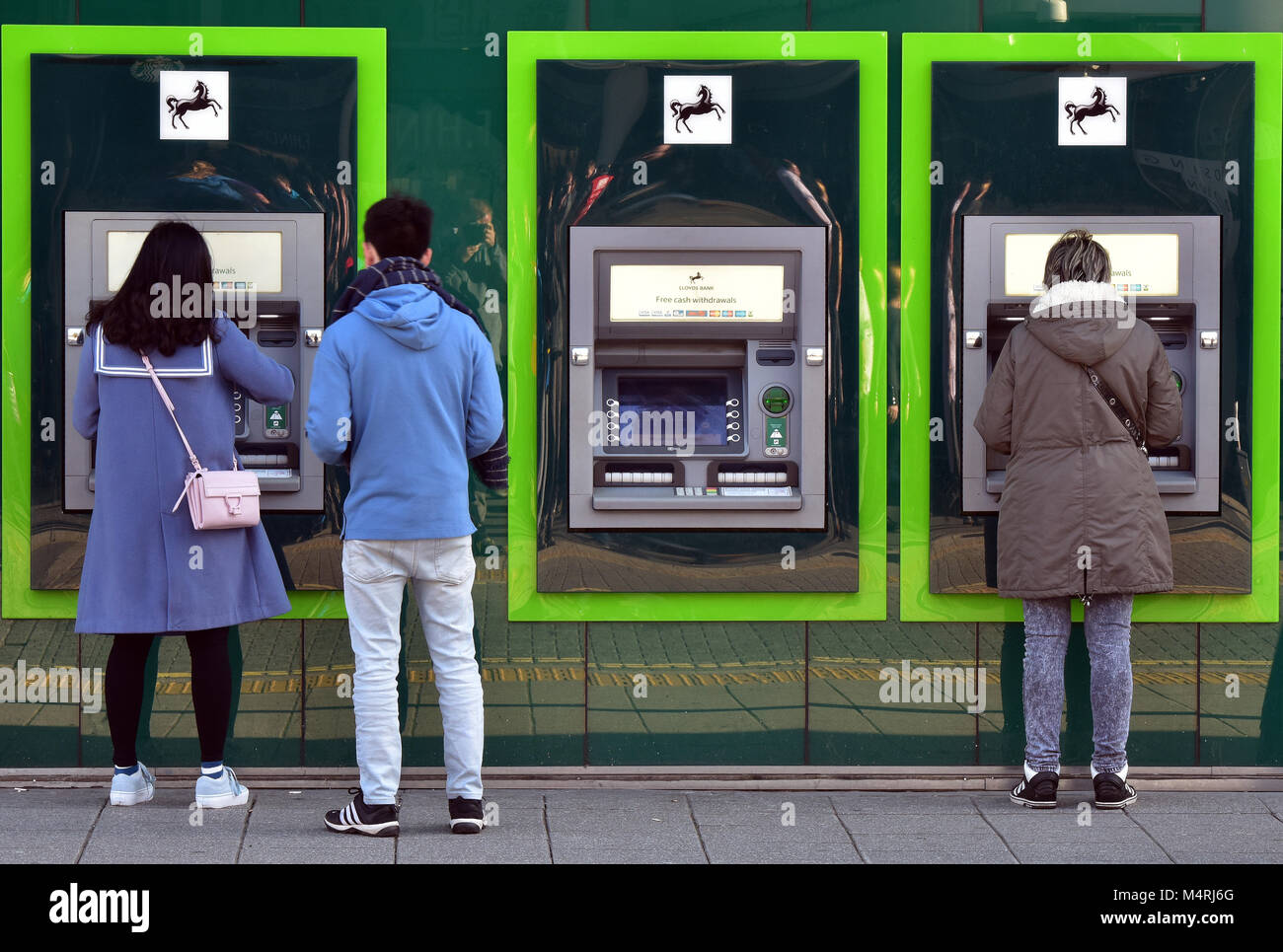 major high street bank cash dispensers or hole in the wall machines outside of lloyds bank high ...