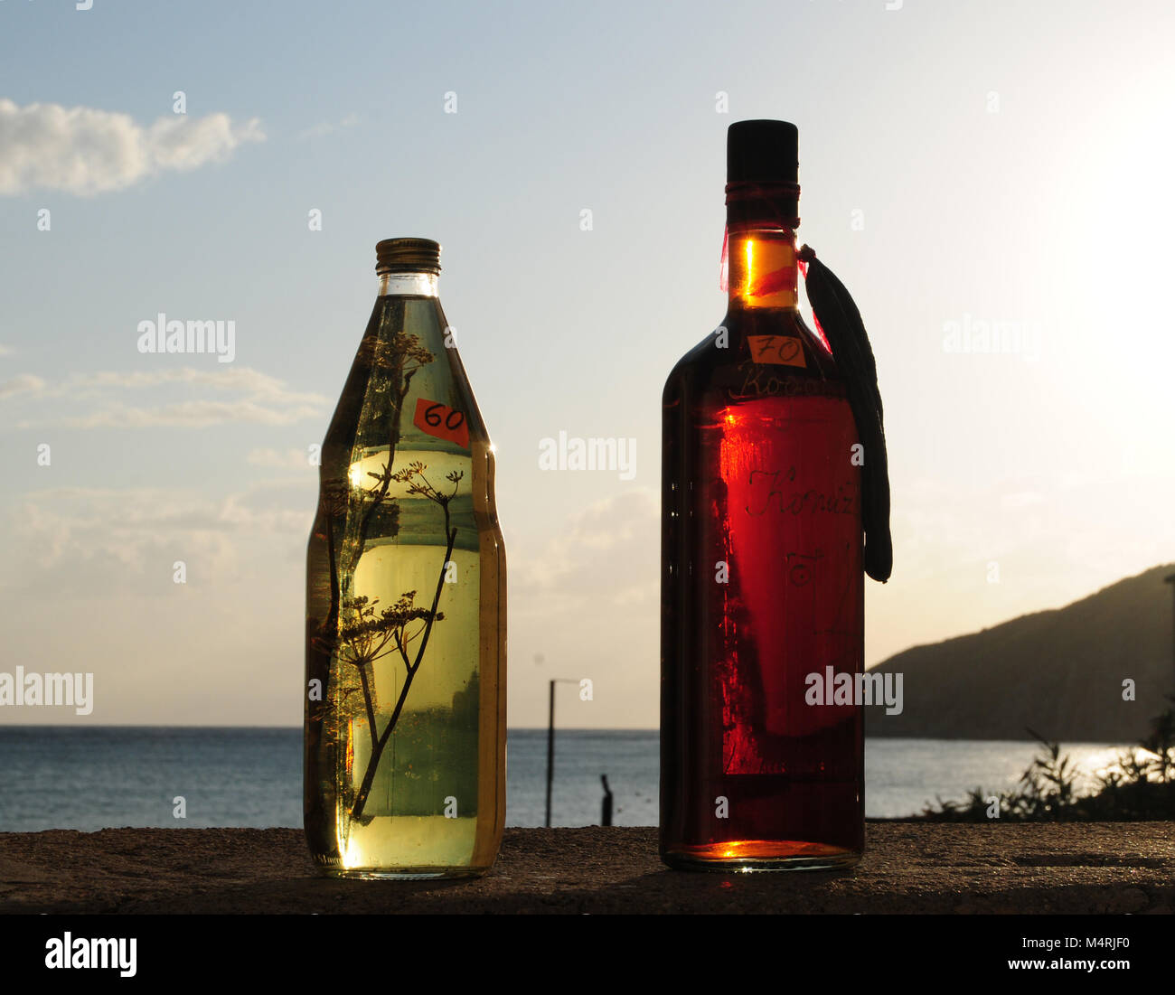 Bottles in sunshine with plants on beach, croatia Stock Photo - Alamy