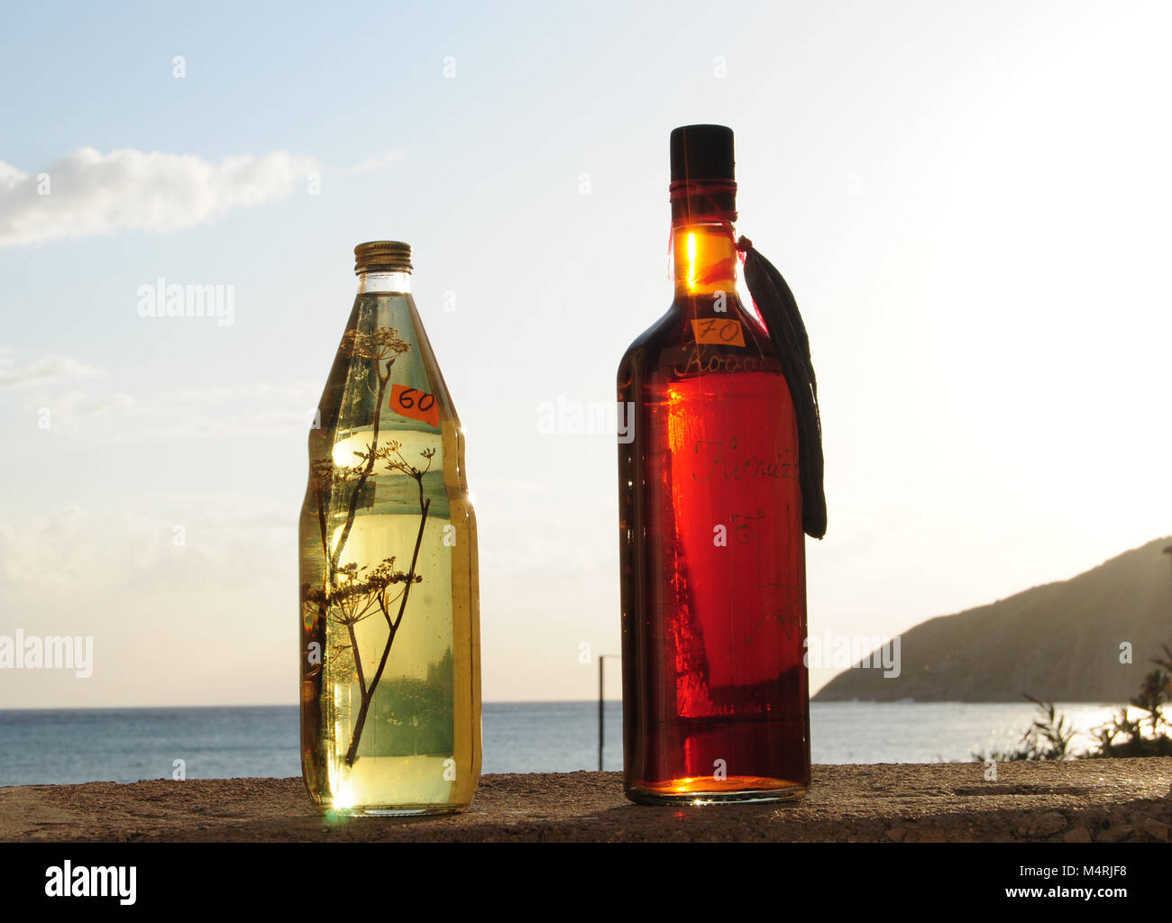 Bottles in sunshine with plants on beach, croatia Stock Photo - Alamy