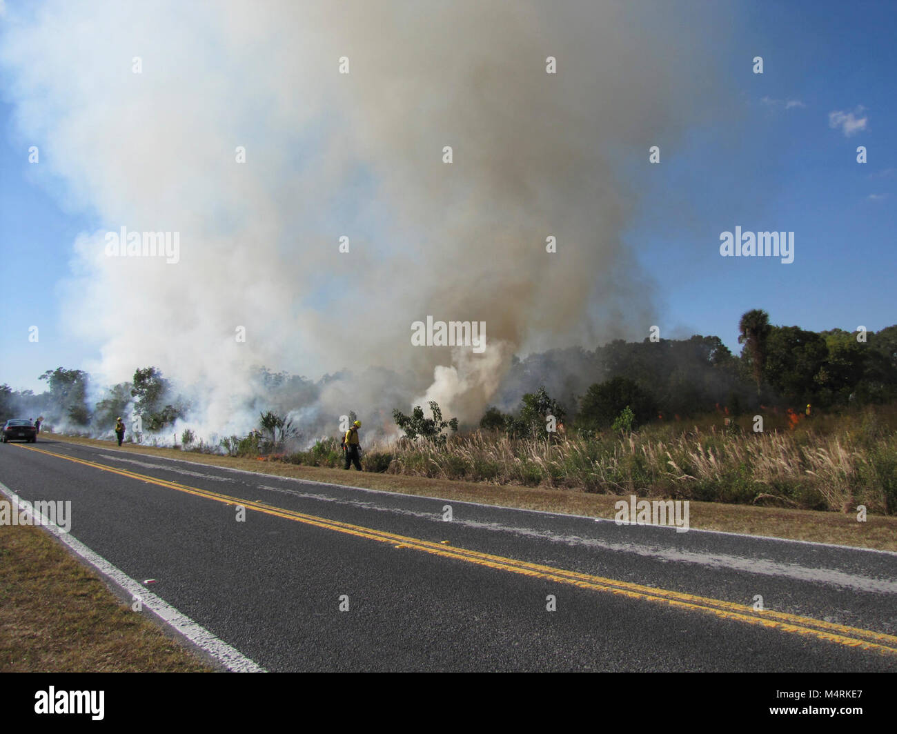 Prescribed fire near park structures Stock Photo - Alamy