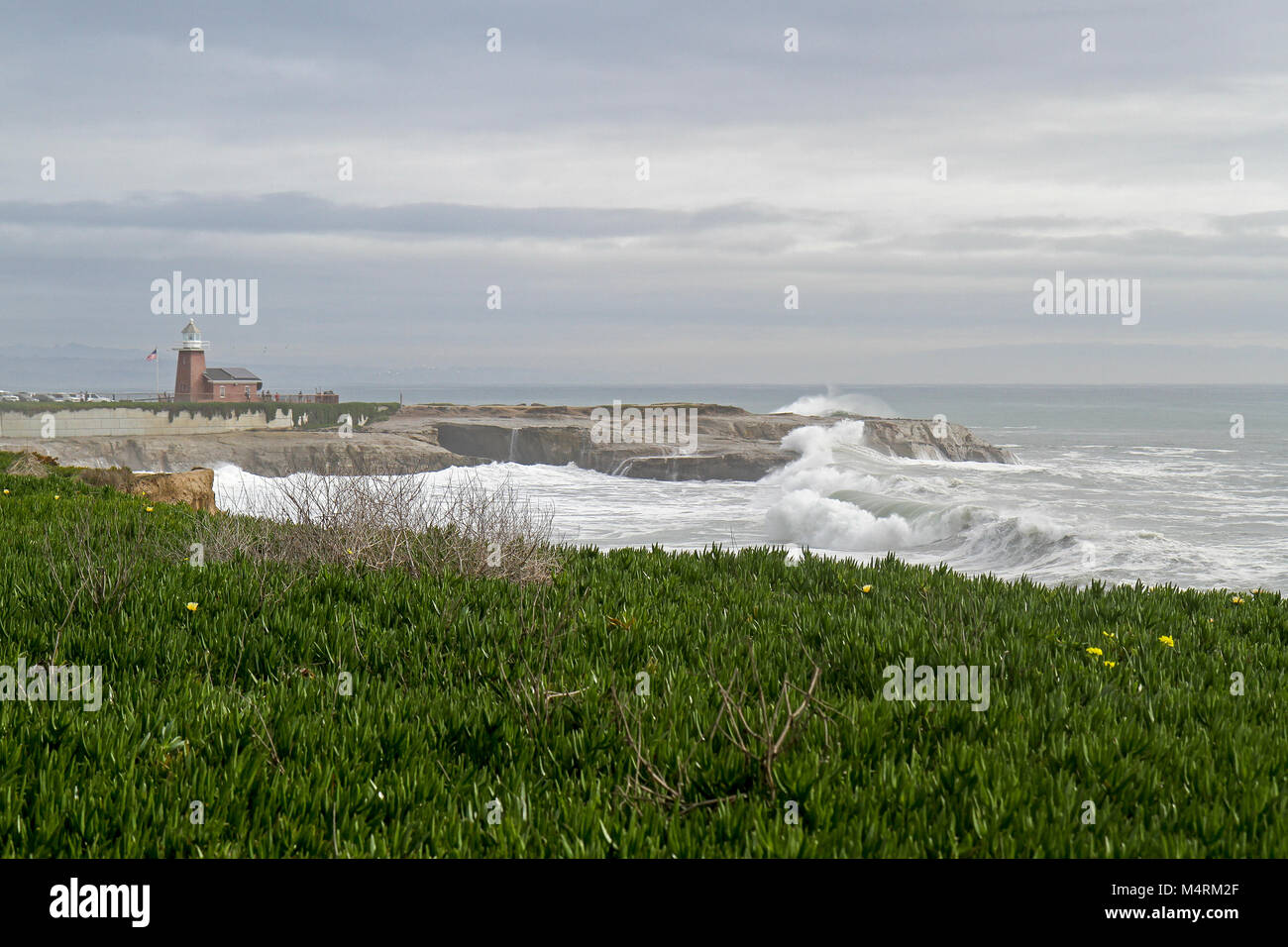 Waves break against cliffs near the Santa Cruz Surfing Museum, Santa ...