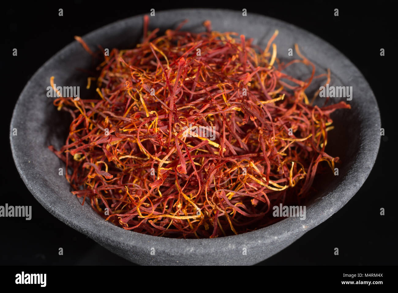 Macro collection, expensive real dried saffron spice close up on black ...