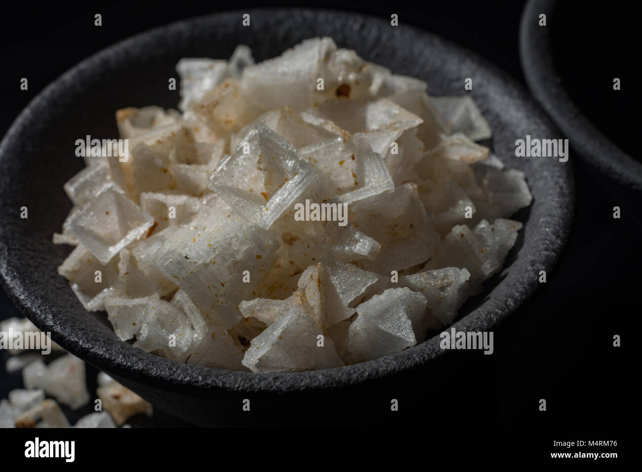 Macro collection, white sea salt pyramide flakes mixed with spices on ...