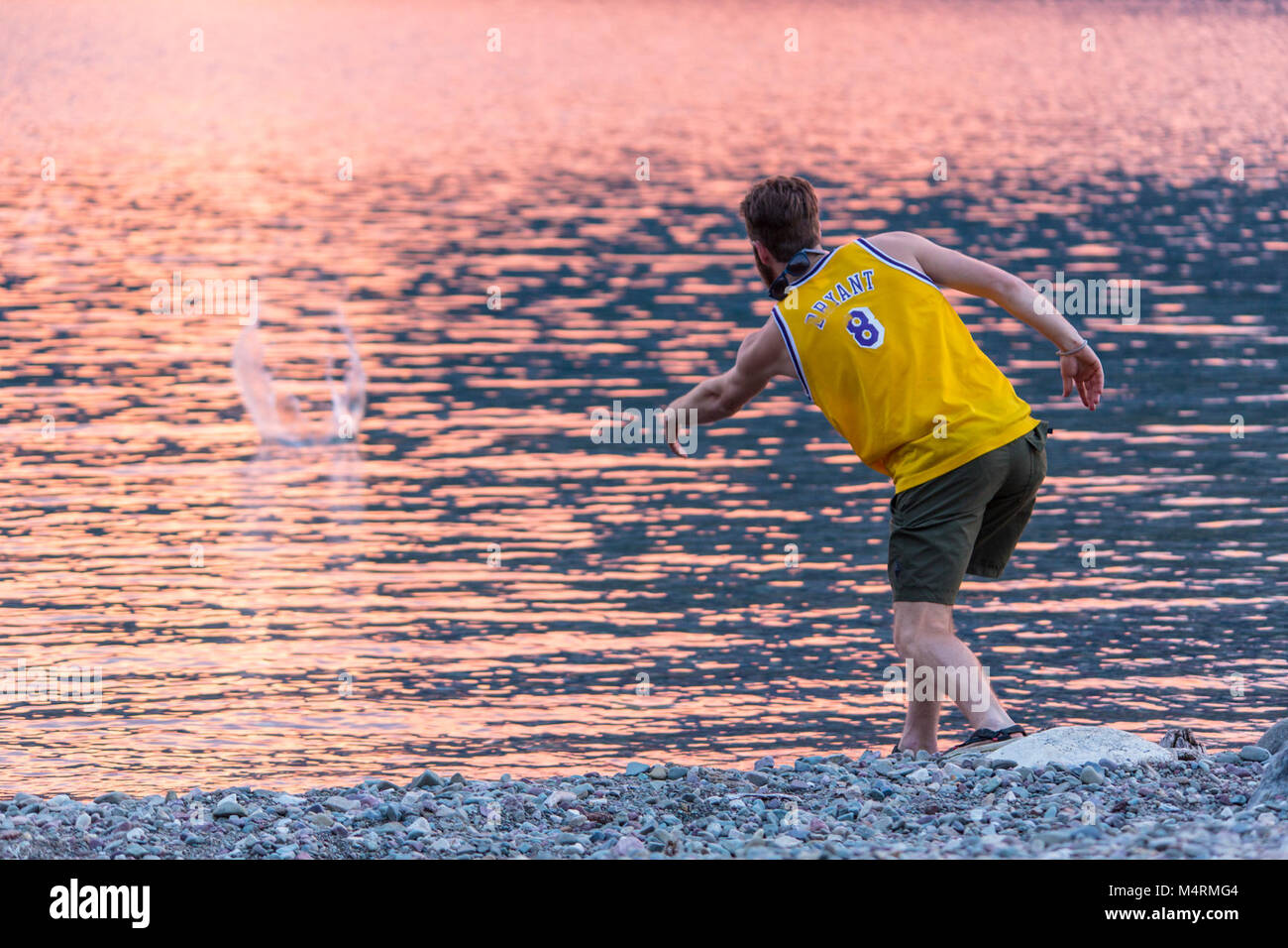 Skipping Rocks at Sunset Stock Photo - Alamy
