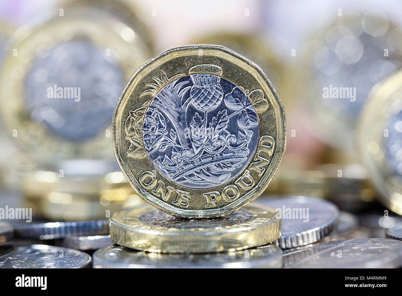 British Sterling. Close up of one pound coins in a horizontal format ...