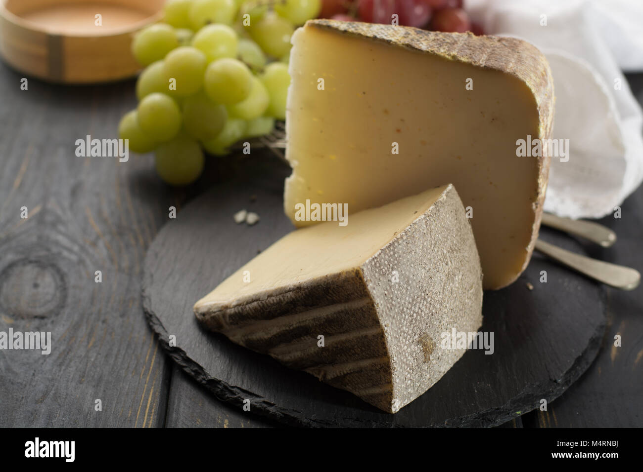 Tasting of ancient french demi soft cheese Tomme from French Alps, made ...