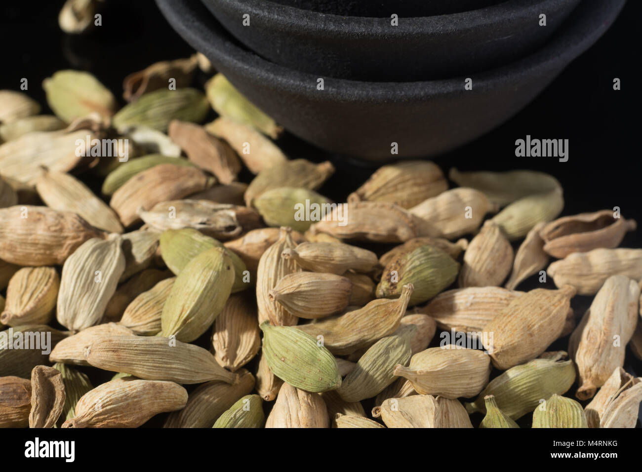 Macro collection, dried green cardamom pods close up on black ...