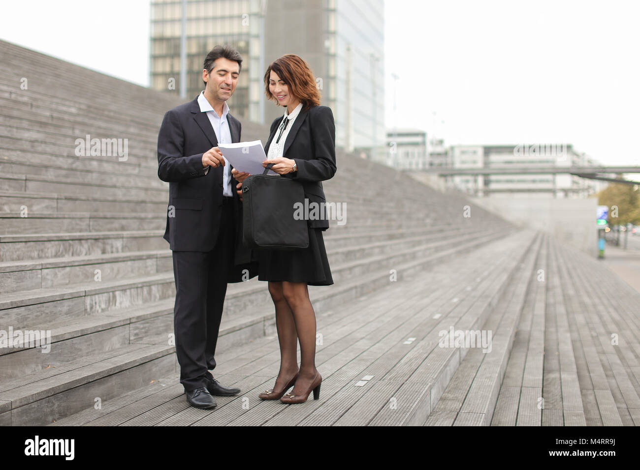 male lawyer speaking with female client Stock Photo - Alamy